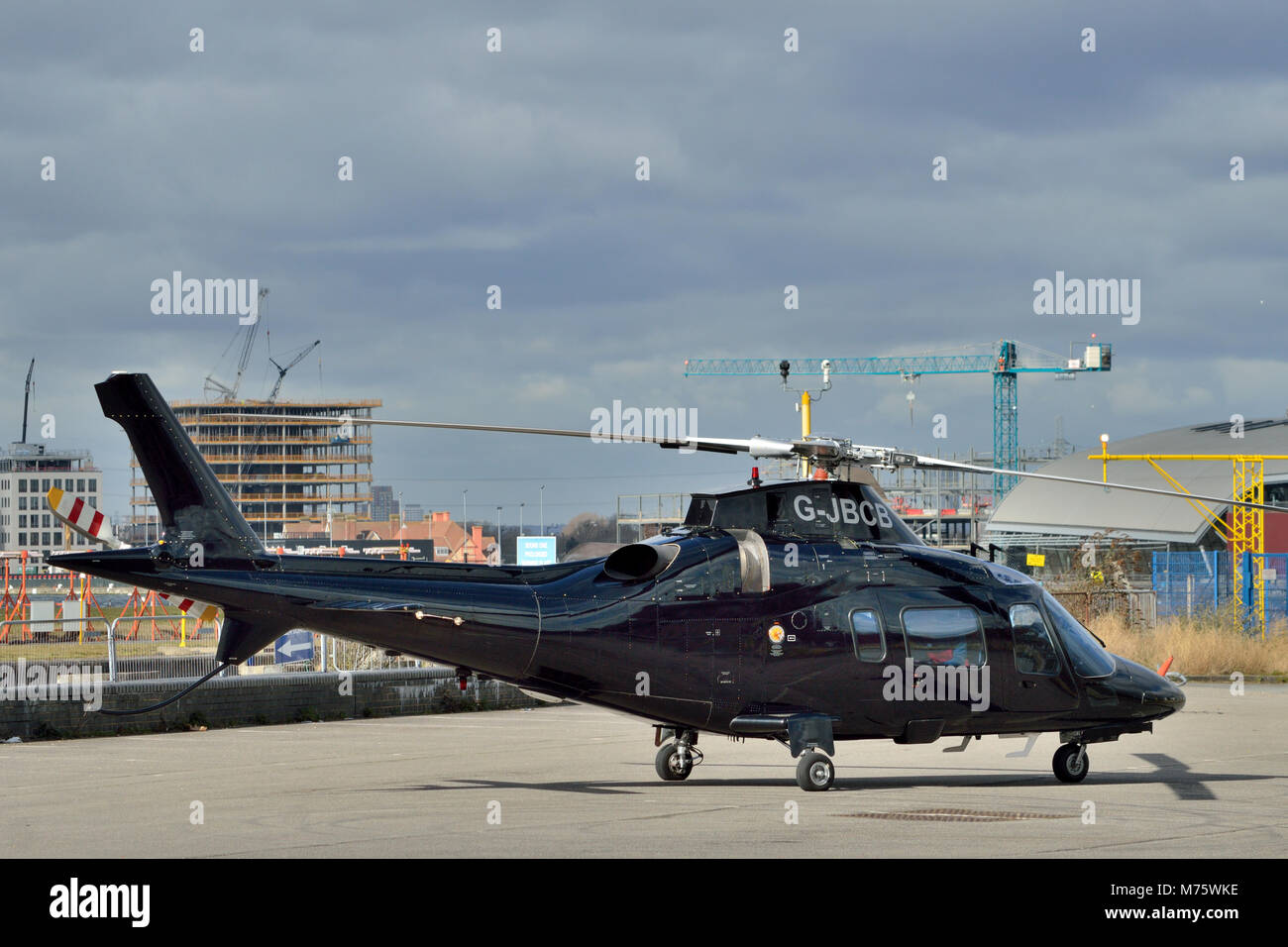 Castle Air Augusta A109 helicopter on the ground in a car park adjacent ...