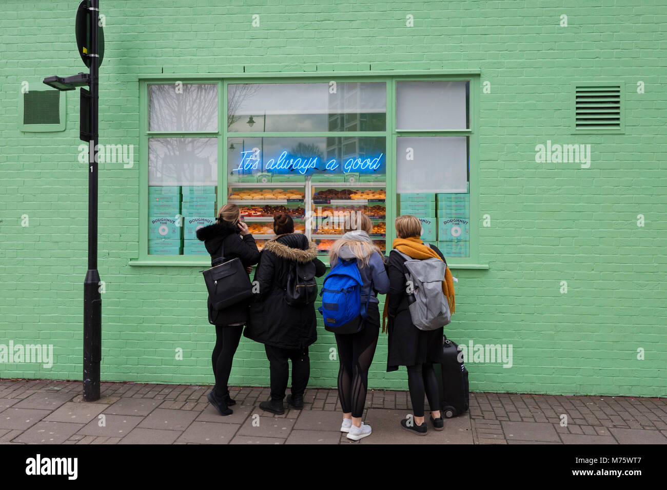 The enticing shop window of Doughnut Time on Old Street in Shoreditch ...