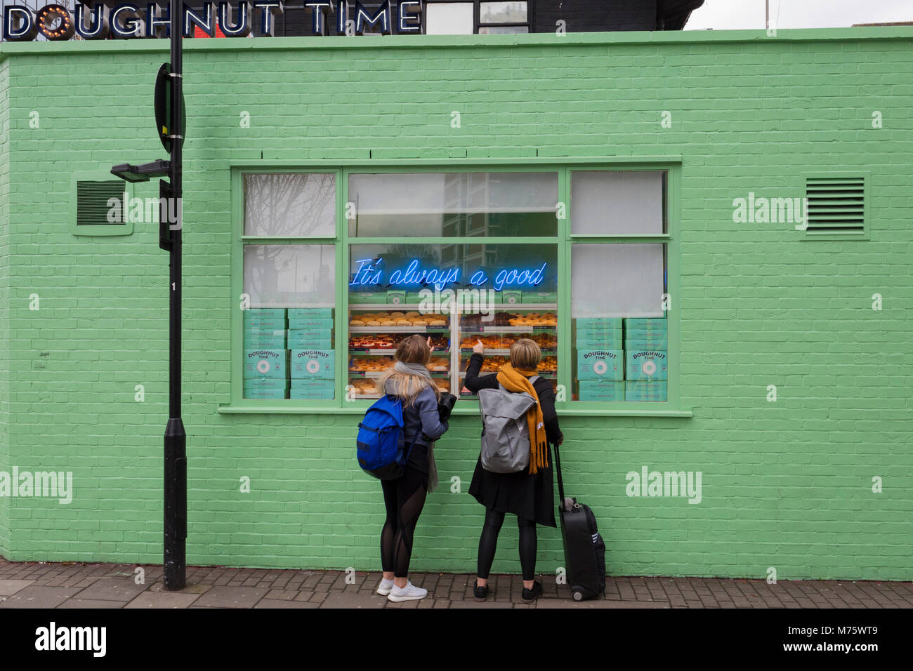 The enticing shop window of Doughnut Time on Old Street in Shoreditch ...