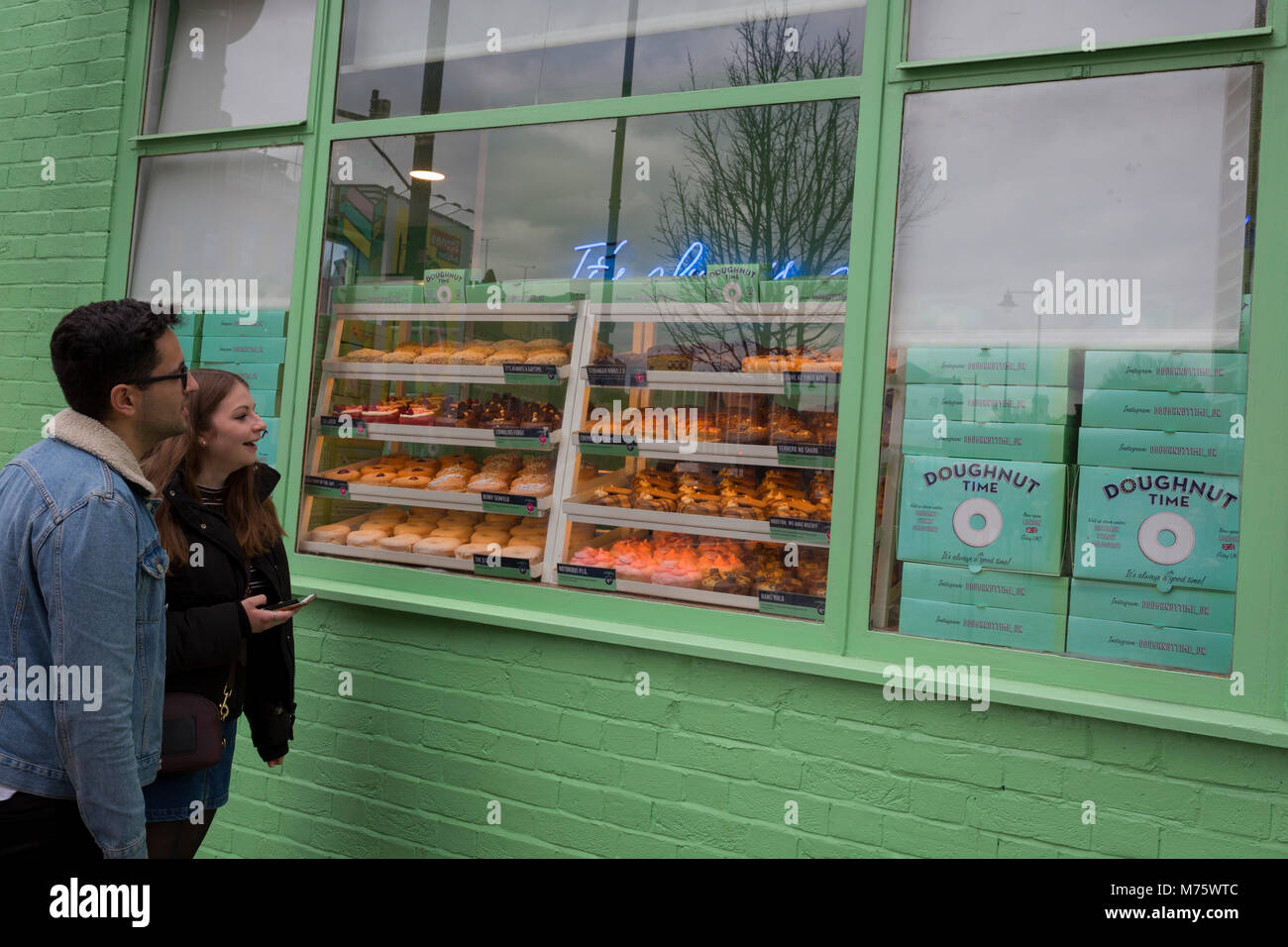 The enticing shop window of Doughnut Time on Old Street in Shoreditch ...