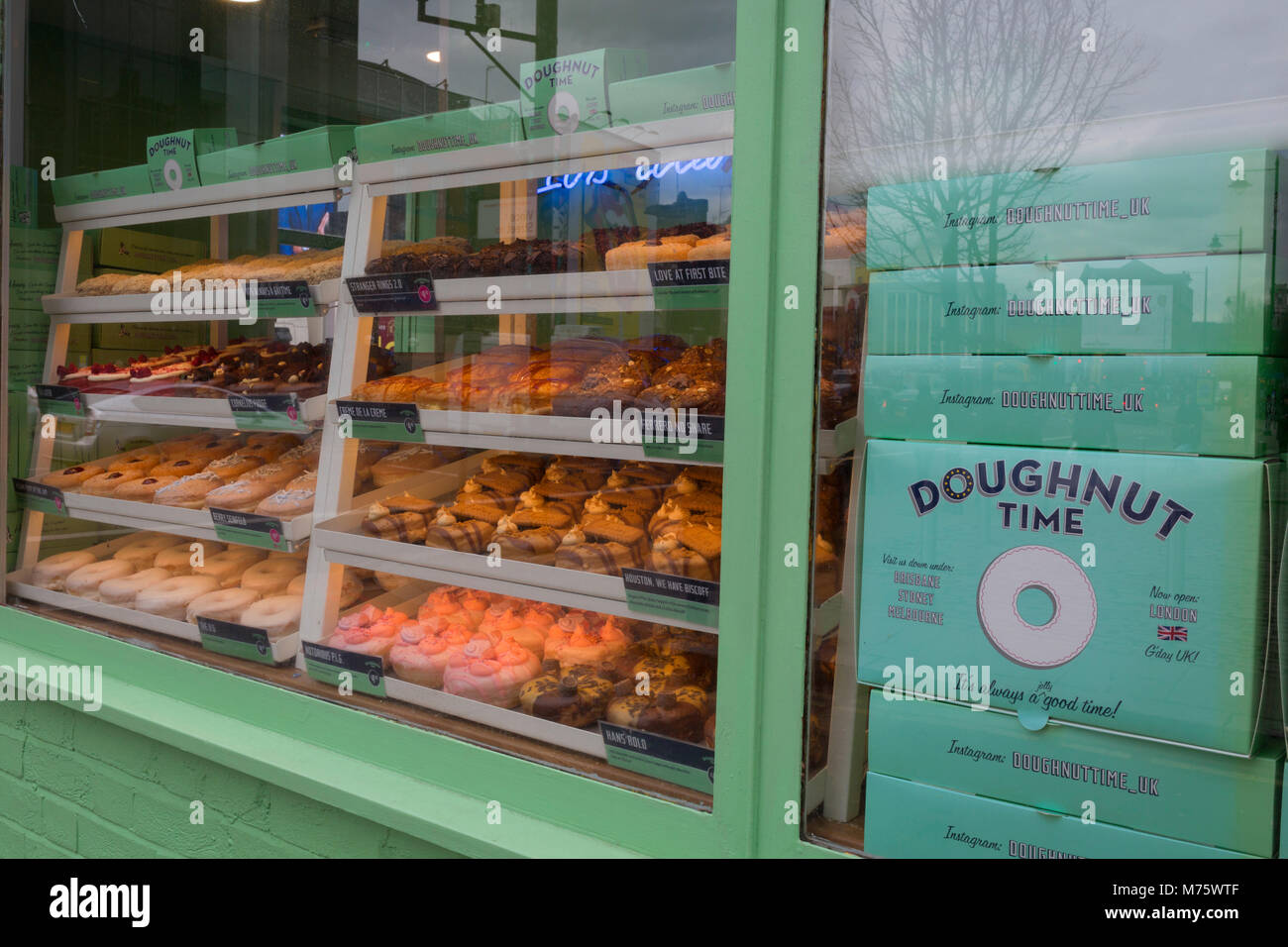 The enticing shop window of Doughnut Time on Old Street in Shoreditch ...