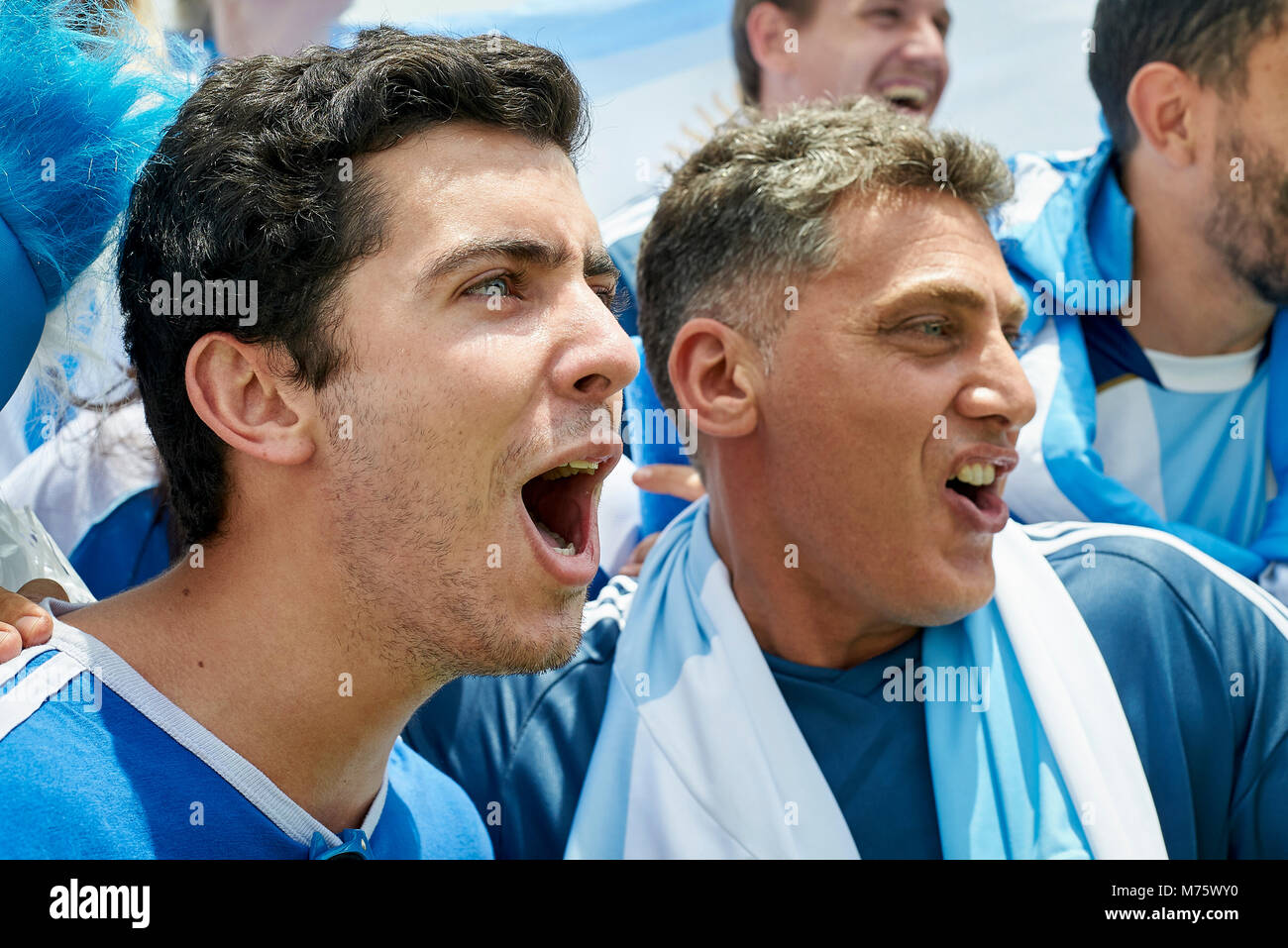 Argentinian football fans watching football match Stock Photo - Alamy