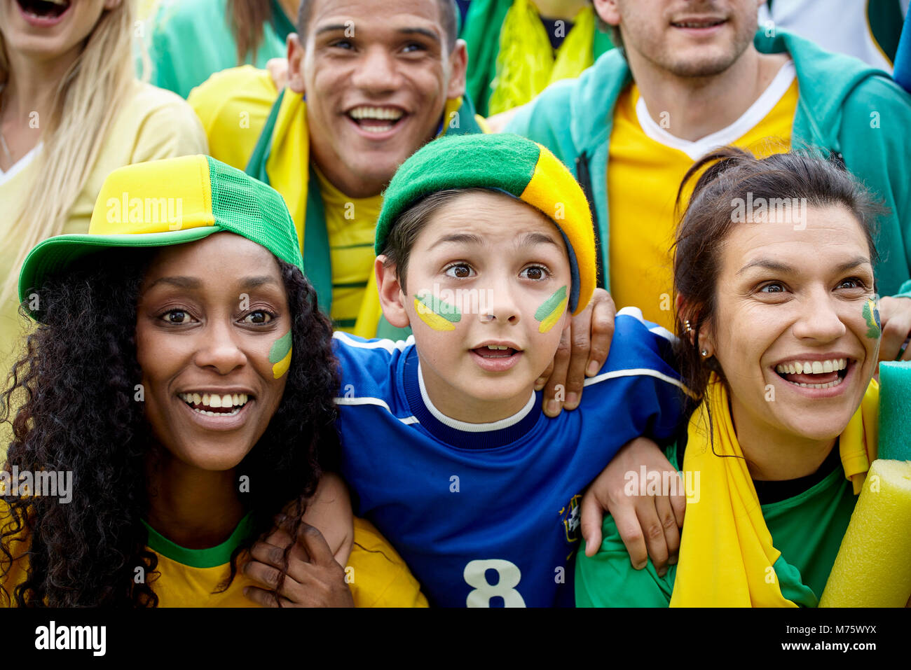 Brazilian football fans watching football match Stock Photo - Alamy