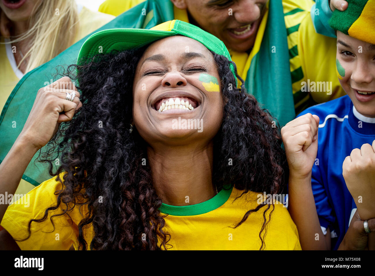 Brazilian football fans cheering at match Stock Photo - Alamy