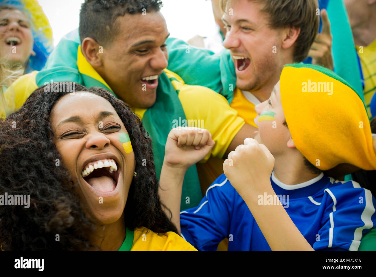 Brazilian football fans celebrating victory at match Stock Photo - Alamy