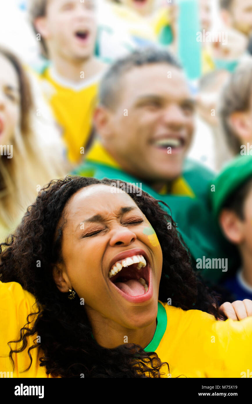 Spectators cheering at football match Stock Photo - Alamy