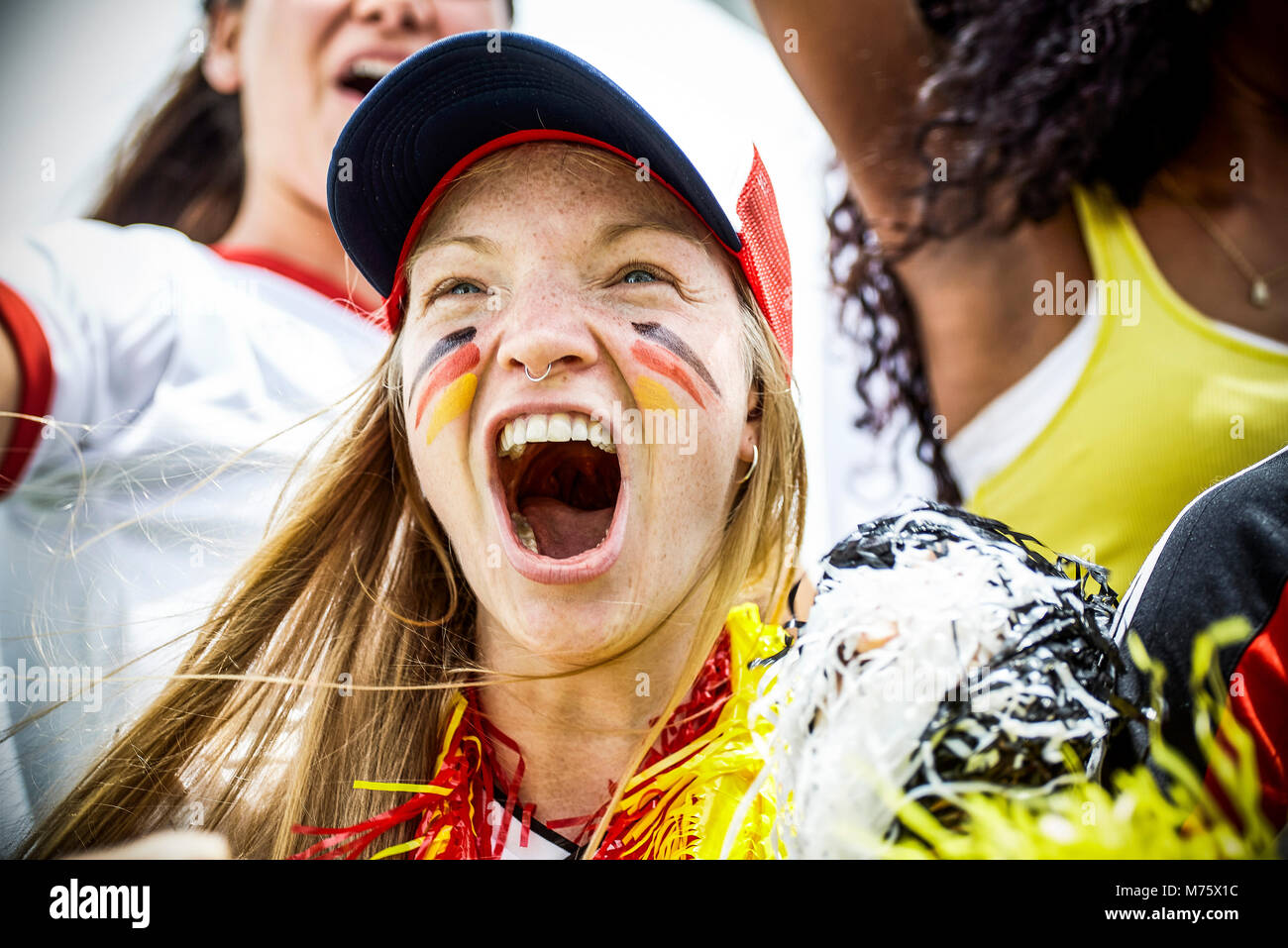 German football fan cheering at match Stock Photo - Alamy