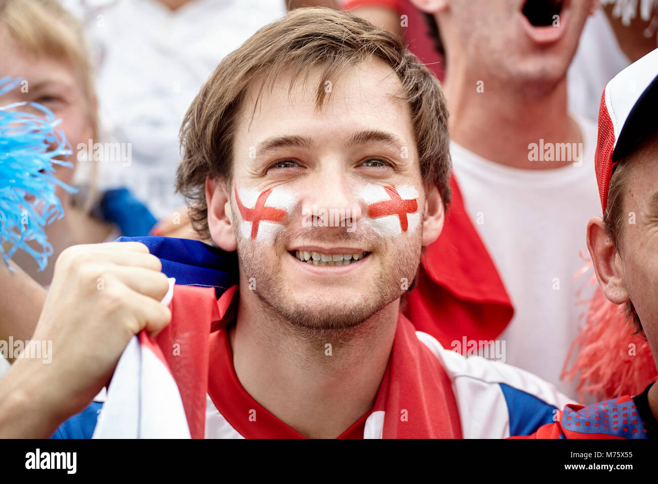 British football fan smiling at match, portrait Stock Photo - Alamy
