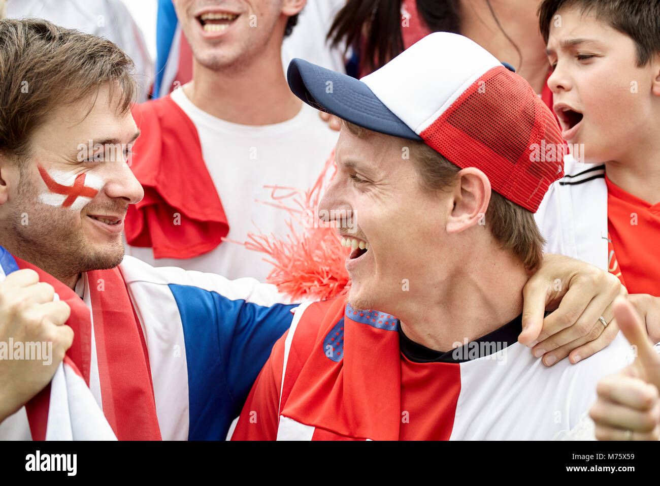 British football fans cheering at match Stock Photo - Alamy