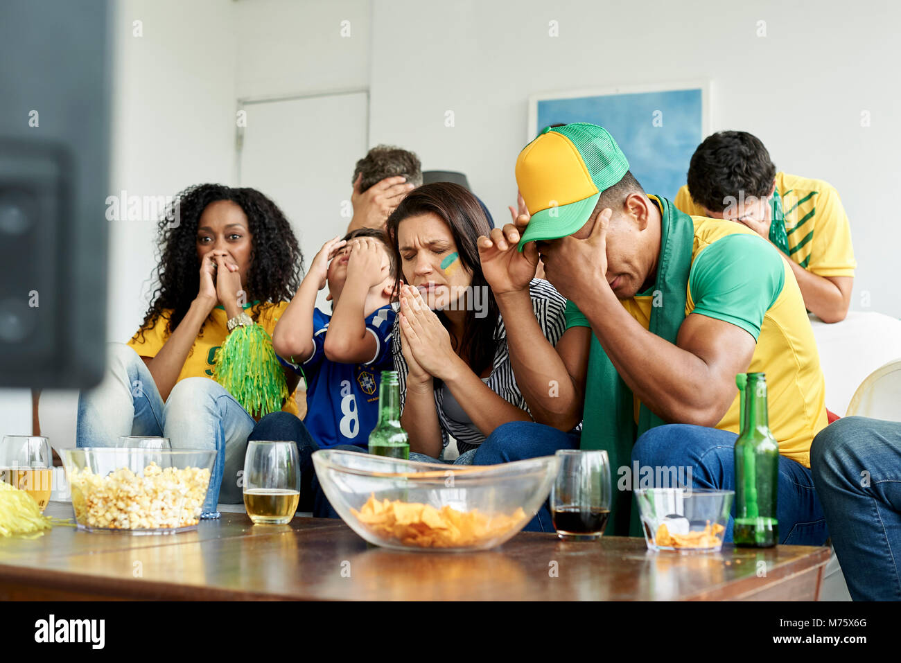 Brazilian soccer fans watching televised match together Stock Photo - Alamy