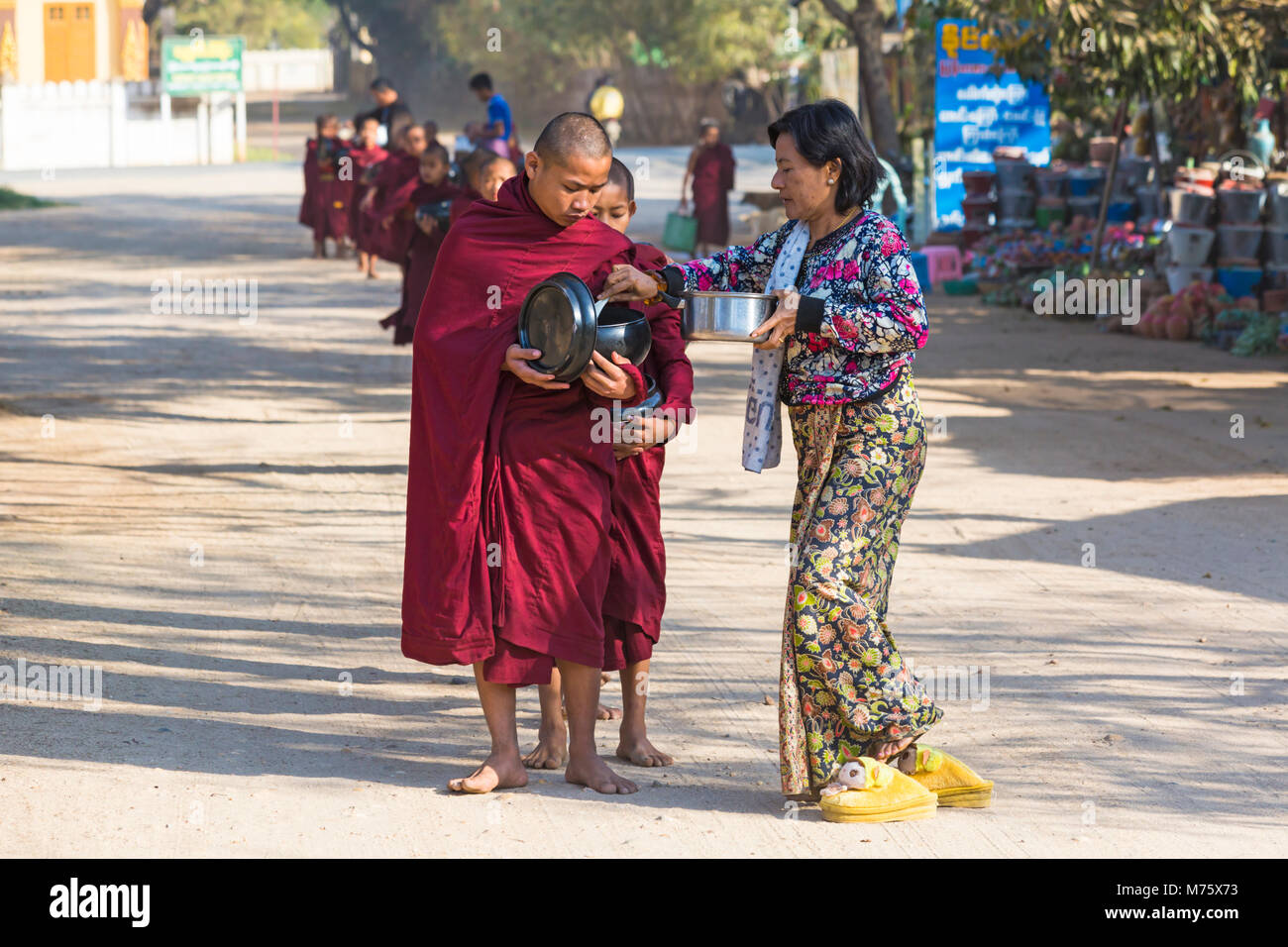 Procession of Buddhist monks collecting alms at Bagan, Myanmar (Burma ...