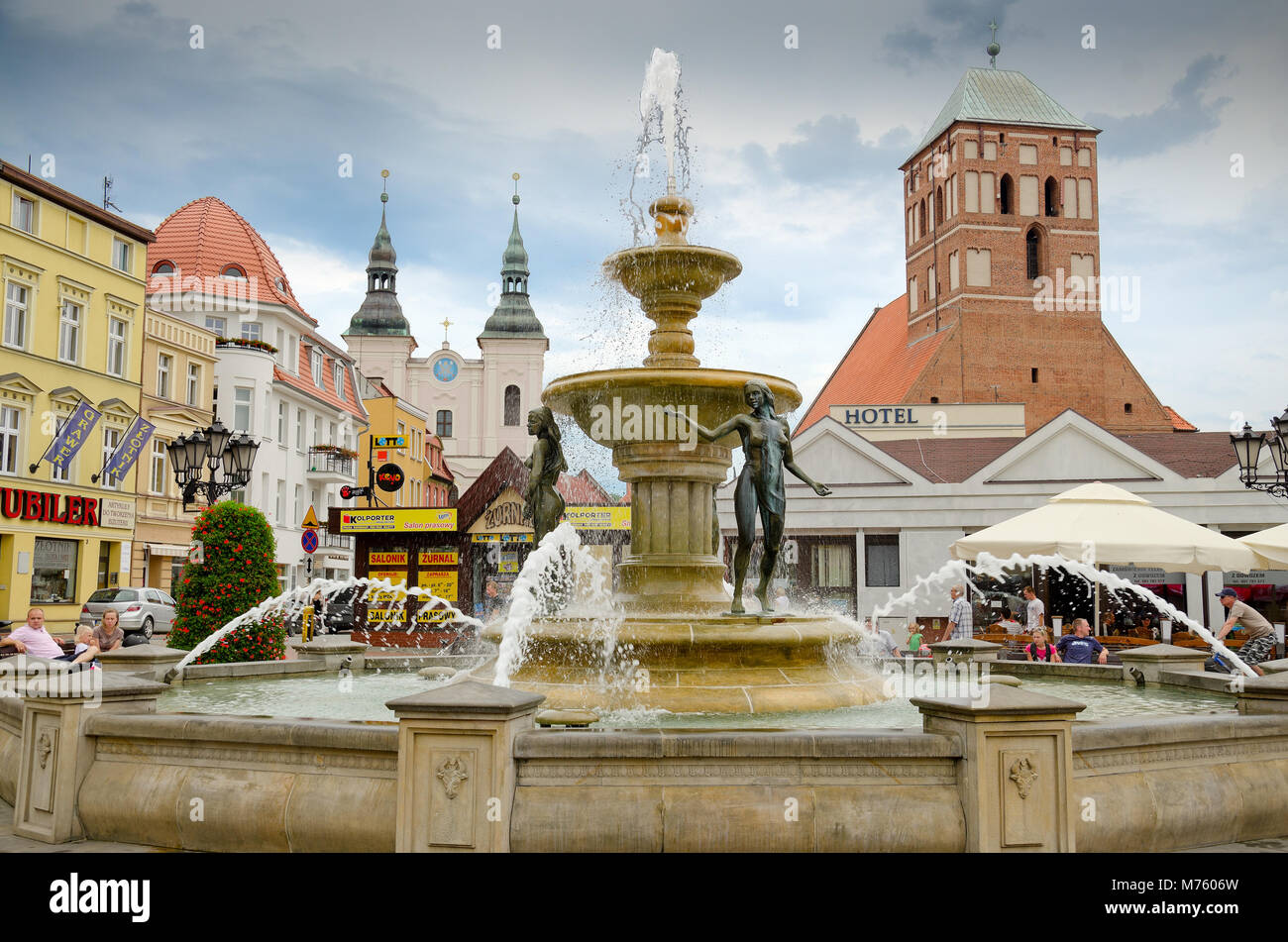 Fountain on Old Market Square, belfries of theBasilica, and a jesuit ...
