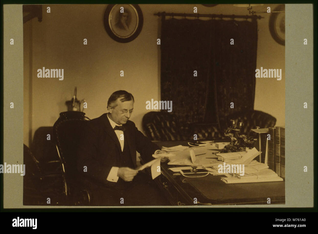 John Wanamaker, three-quarter length portrait, seated at desk, facing ...