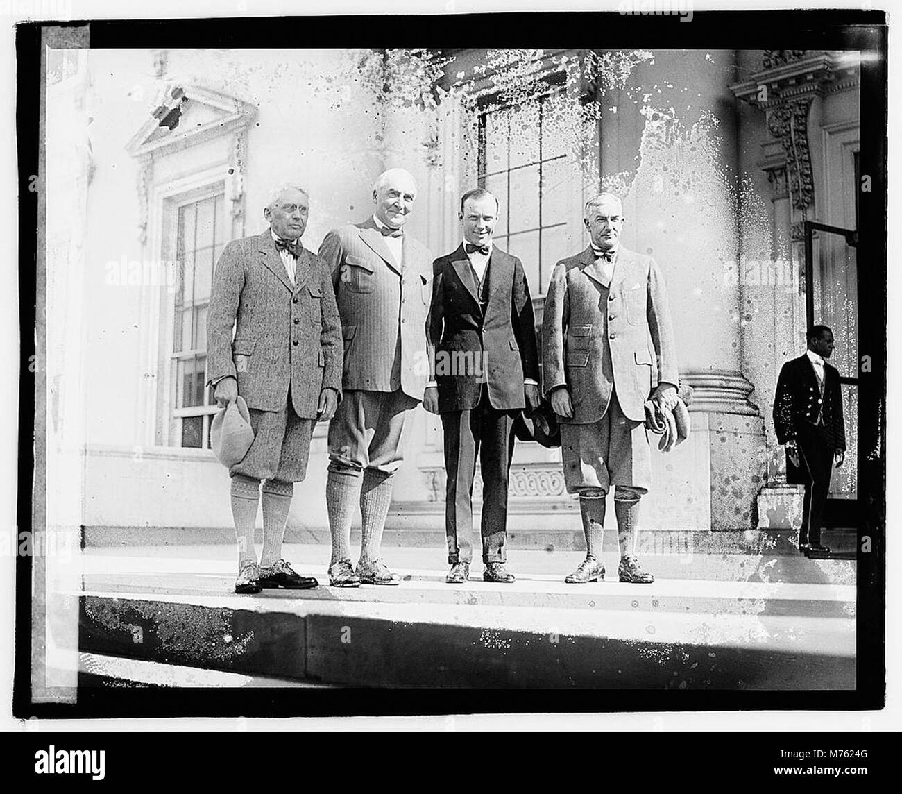 This image features four men: Kellogg, Harding, Chuck Evans, and ...