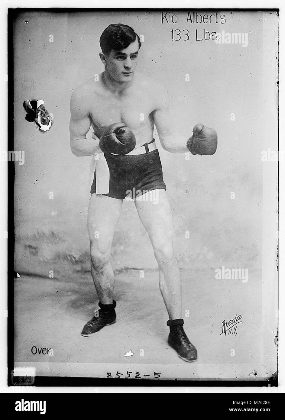 A photograph of Kid Albert, a boxer weighing 133 lbs, capturing his ...