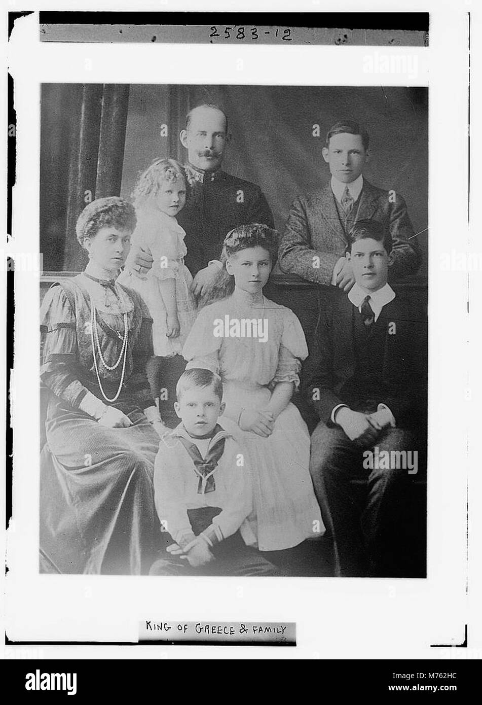 This photograph features the King of Greece with his family. The royal ...