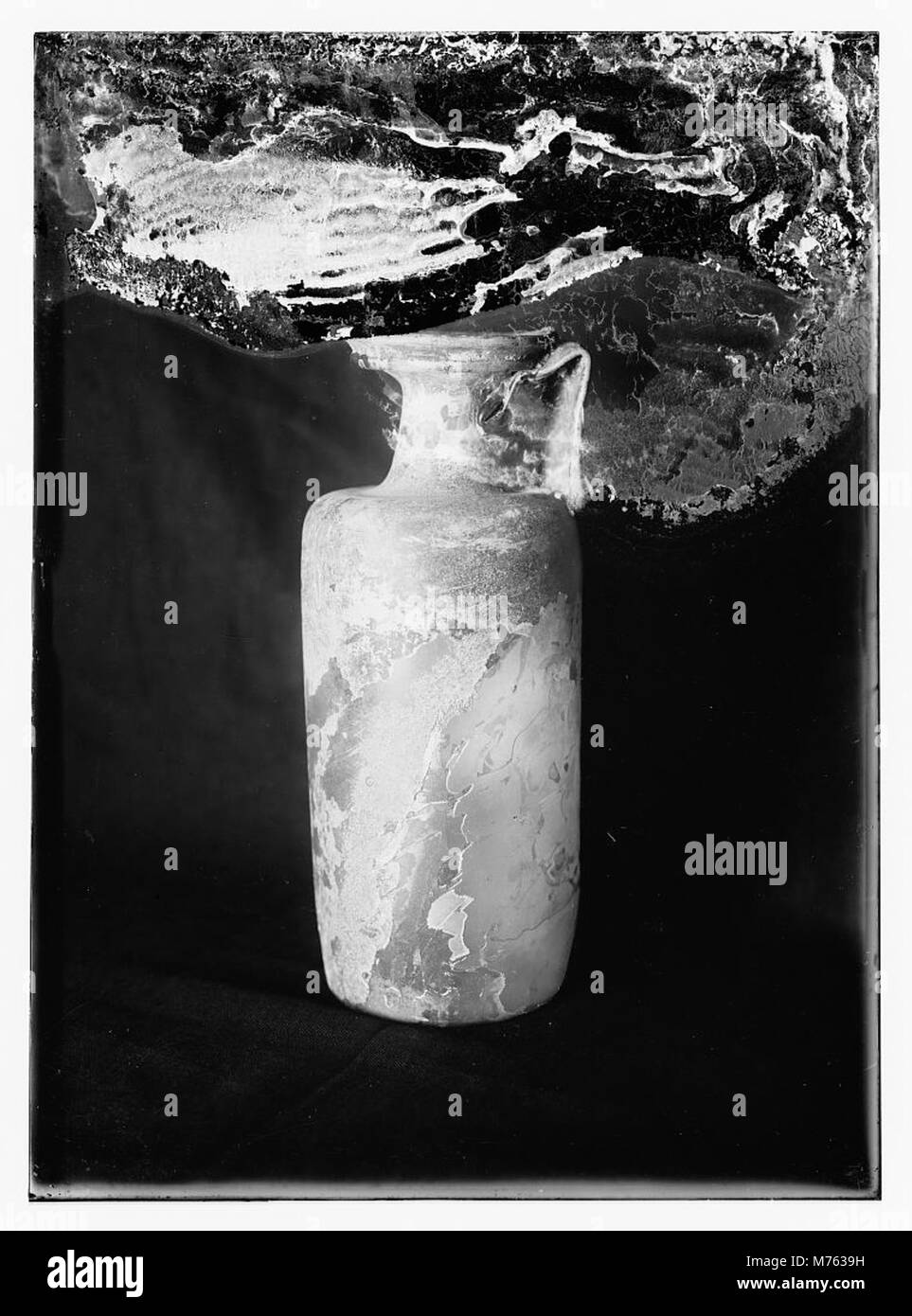 This image shows a piece of antique glass, highlighting craftsmanship ...