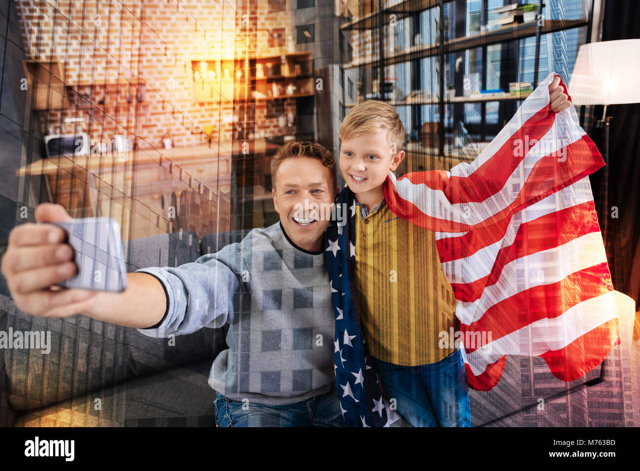 Excited immigrants taking photos with the American flag and feeling ...