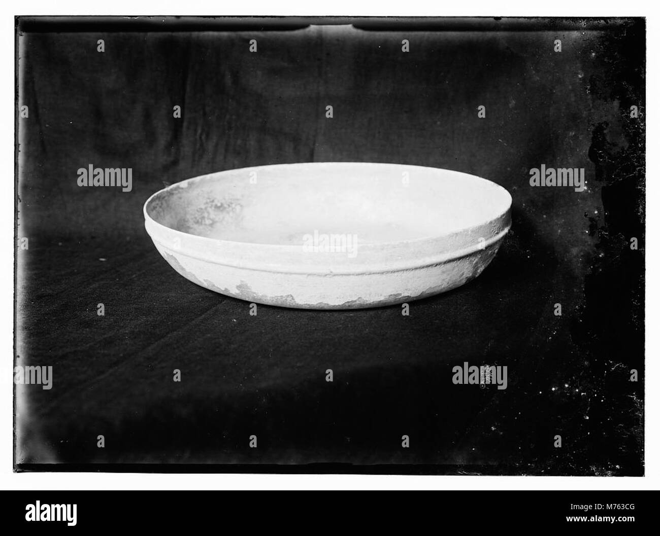 Antique glass objects, such as decorative vases and drinking glasses ...