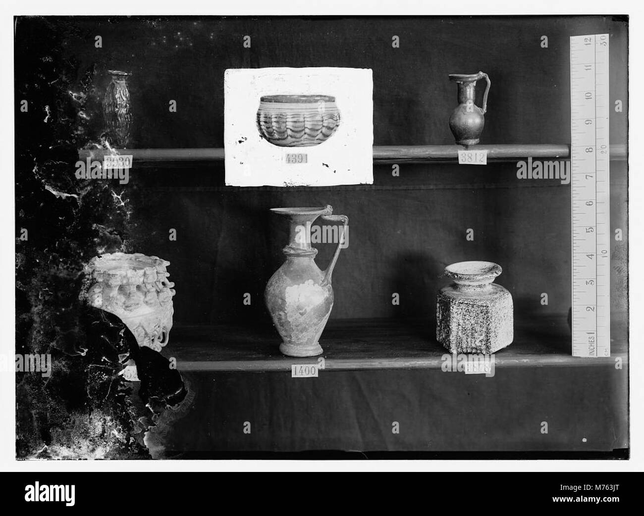 A photograph showcasing a collection of antique glass pieces. The items ...