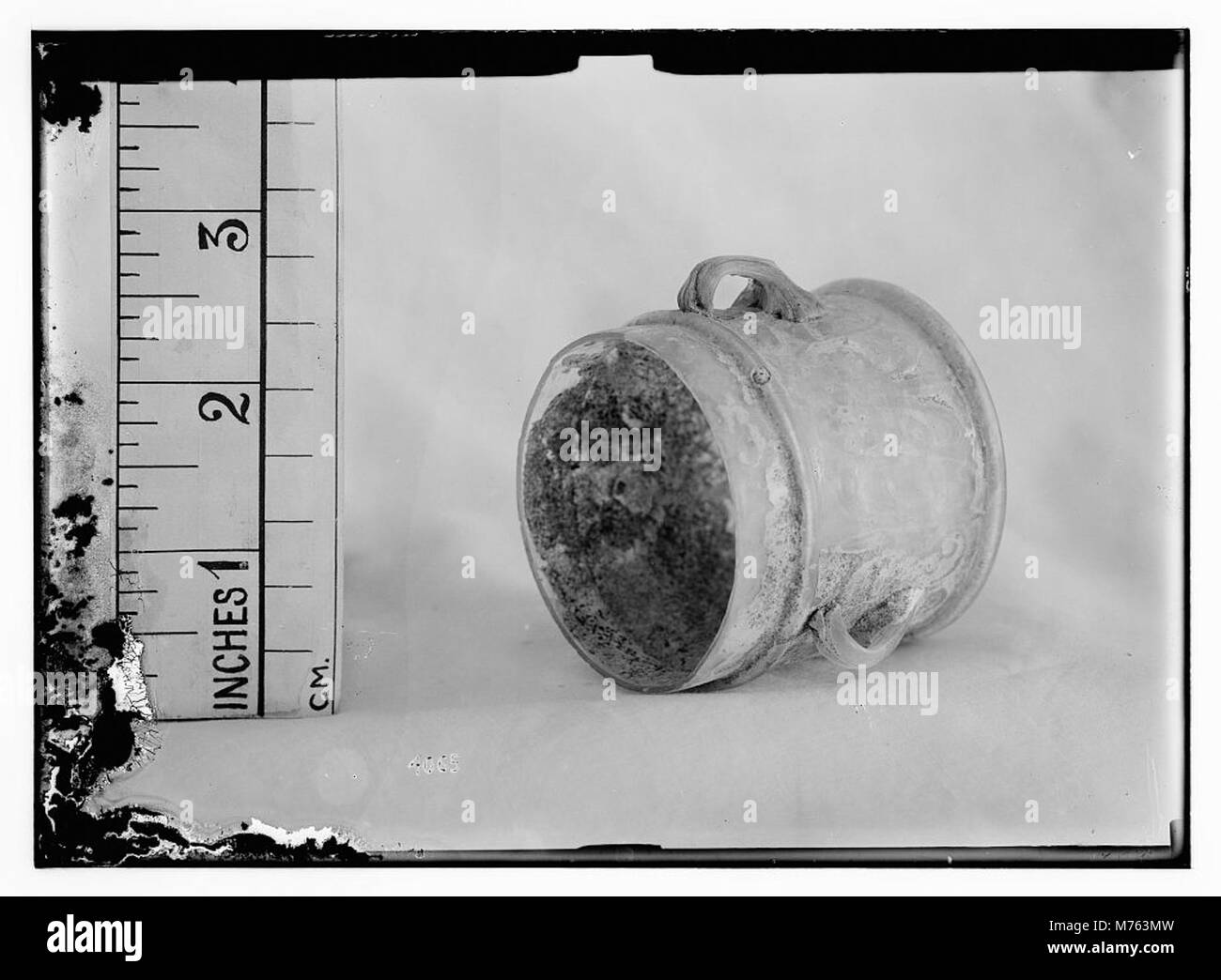 This image depicts an antique glass object, showcasing the ...