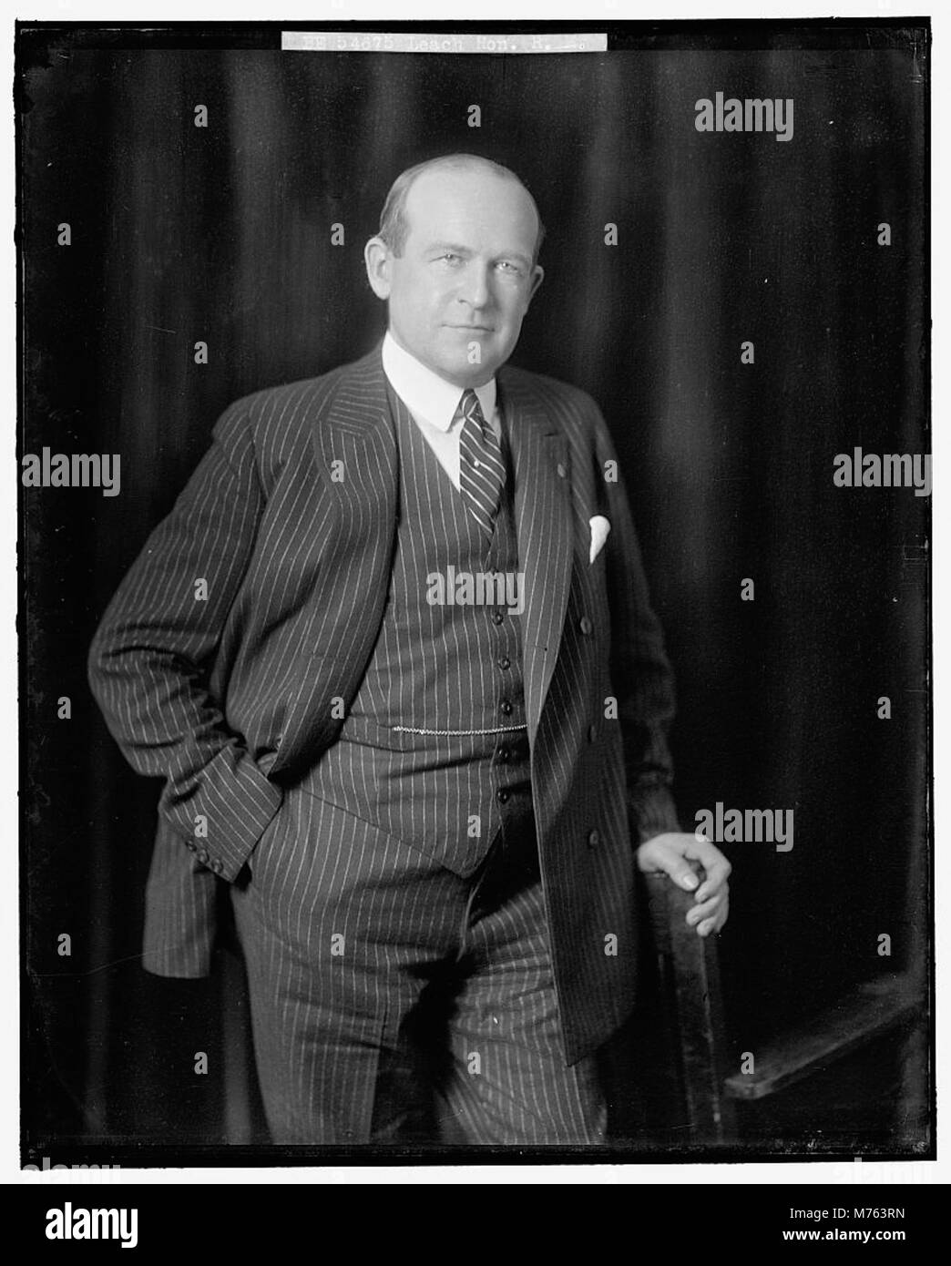 A formal portrait of R.M. Leach, an honorable figure, likely in a ...