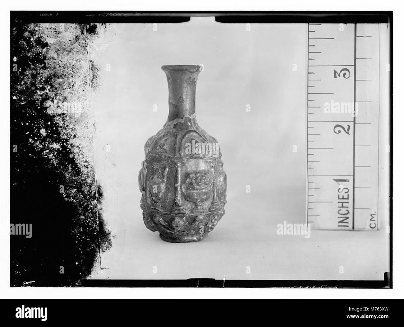 This image showcases an antique glass piece, representing craftsmanship ...