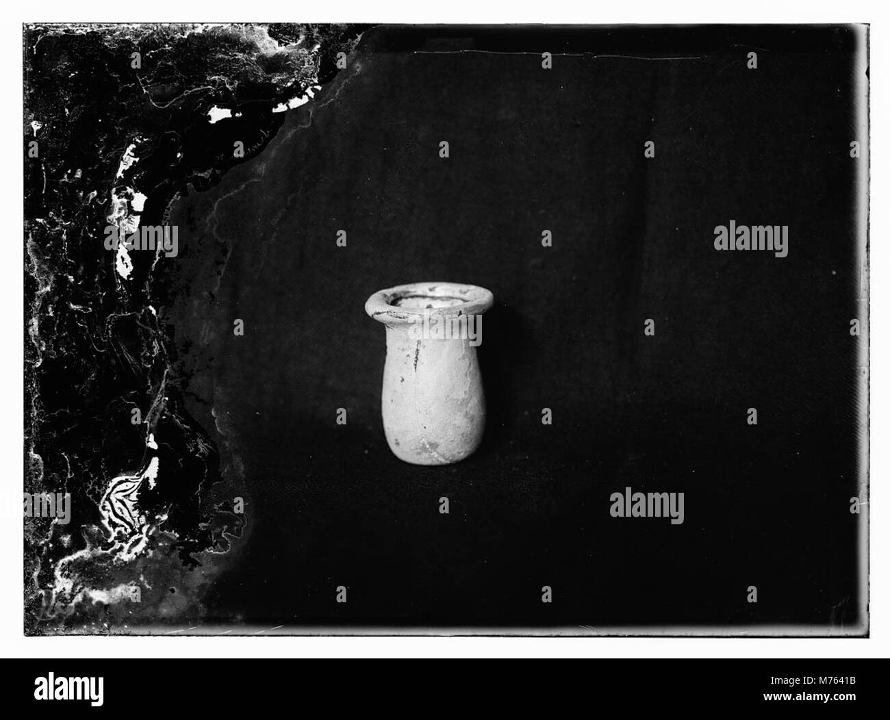 A photograph showcasing an antique glass object, highlighting its ...