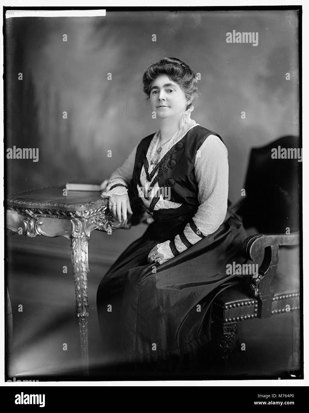 A photograph of Ernest Lister and Mrs. Lister, captured for archival ...