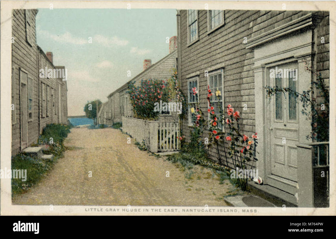An image of a small gray house, likely in the eastern United States ...