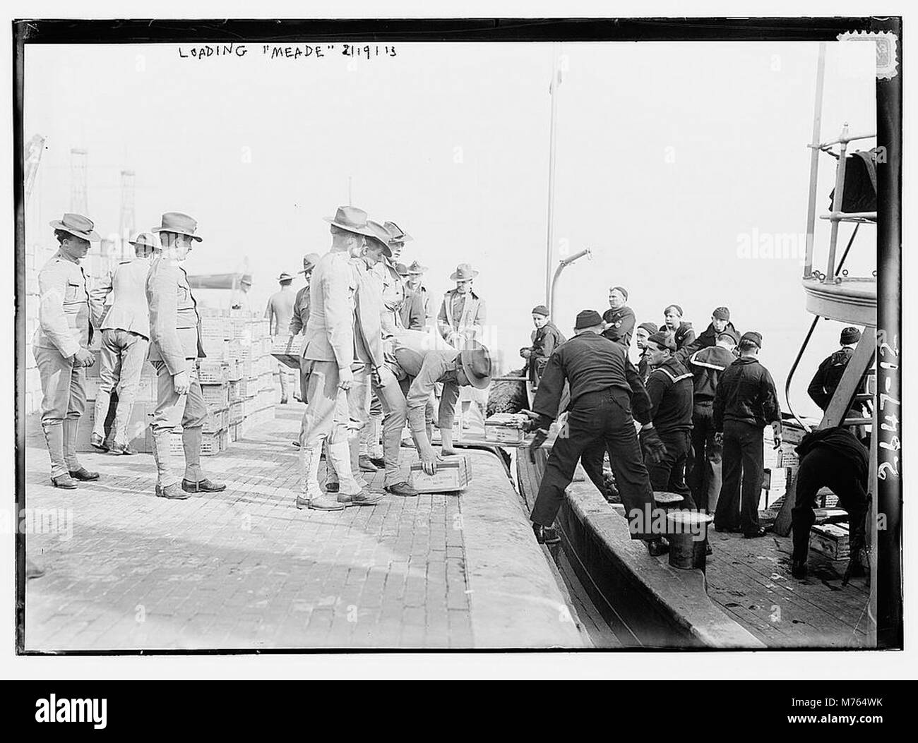 A photograph depicting the loading of the U.S. military vessel Meade ...