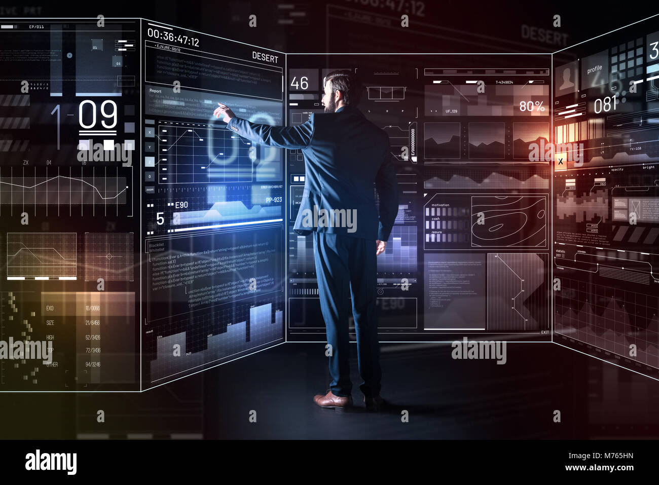 Careful programmer touching the screen while working at the program Stock Photo - Alamy