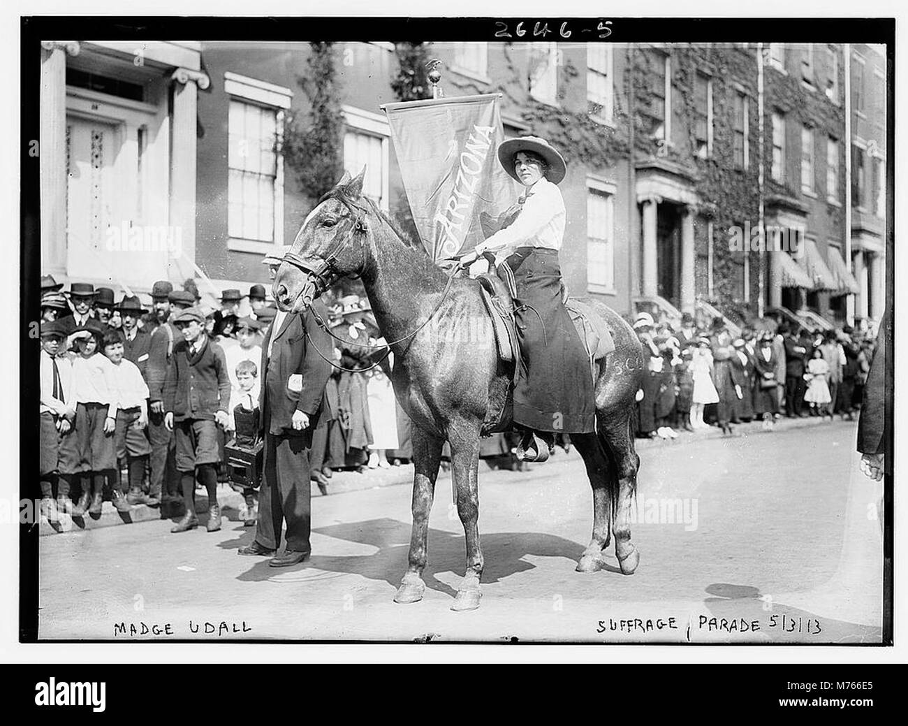 A historical photograph of Madge Udall participating in a suffrage ...