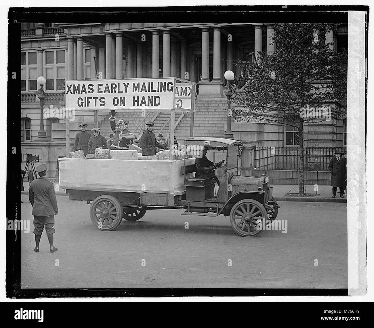 A photograph of an early parade, likely related to postal services or a ...
