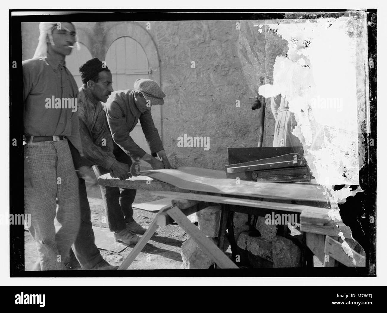 A photograph depicting the process of making locust traps, illustrating ...