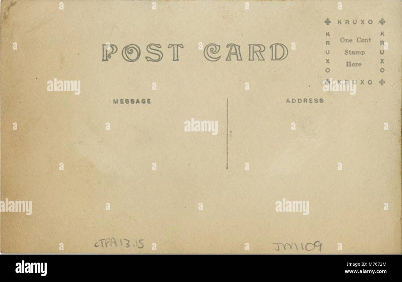 The image captures a man sitting at a desk, reading, with numerous ...