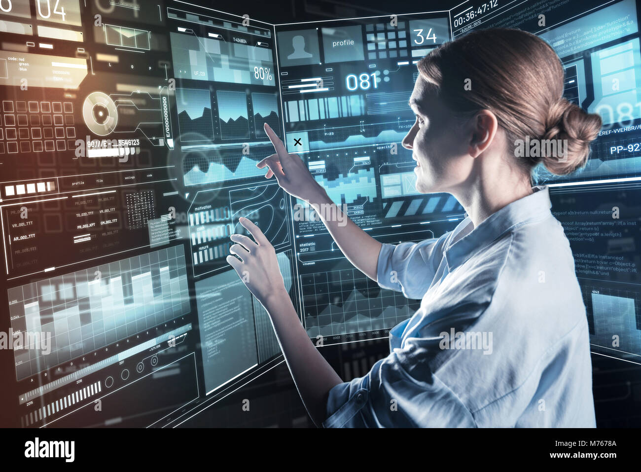 Smart woman smiling and working with a modern device Stock Photo - Alamy