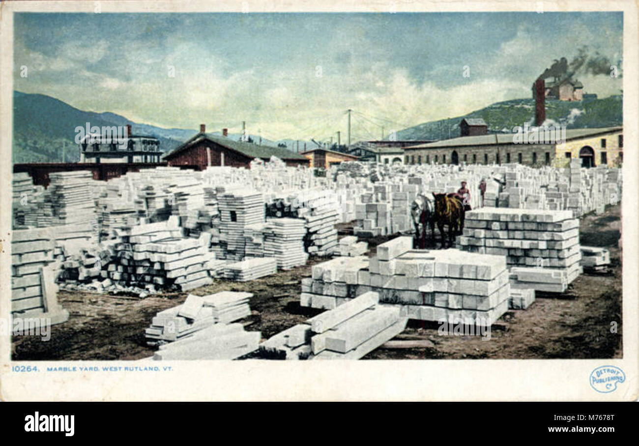 A photograph of a marble yard, showcasing stacks of marble stones ...