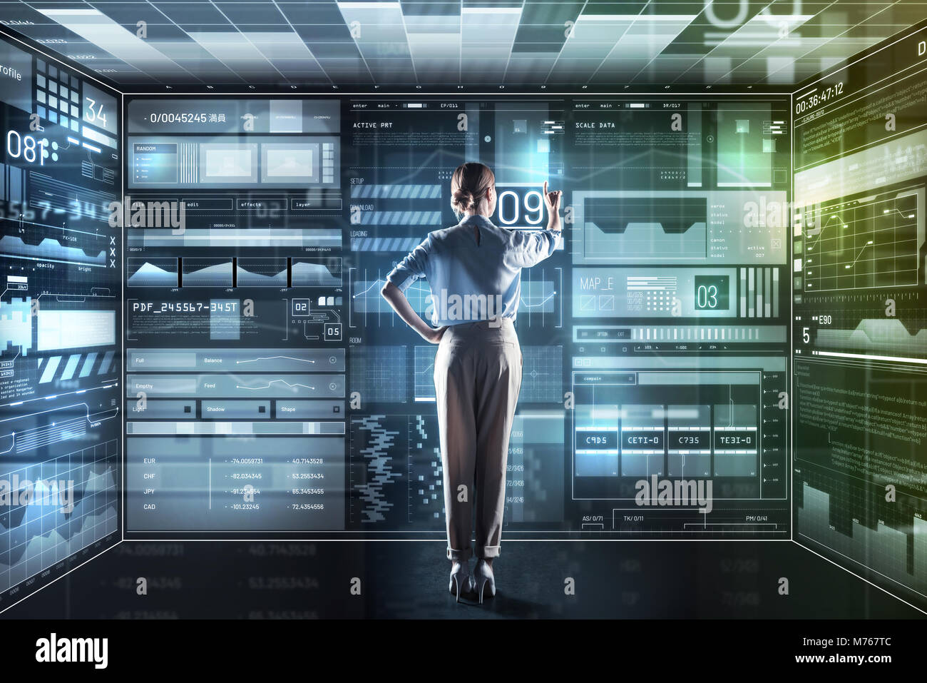 Calm programmer putting her hand up while touching the transparent ...