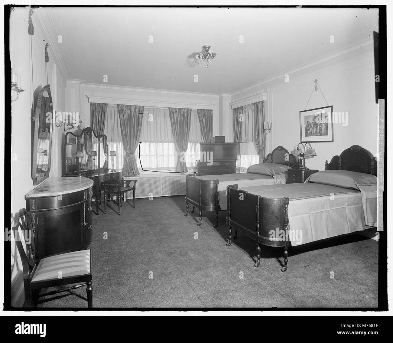 A photograph of a bedroom in the Mayflower Hotel, showcasing the ...