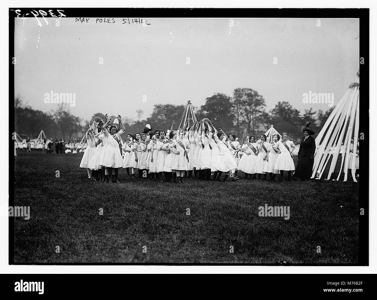 This image shows a traditional Maypole, used in celebrations marking ...
