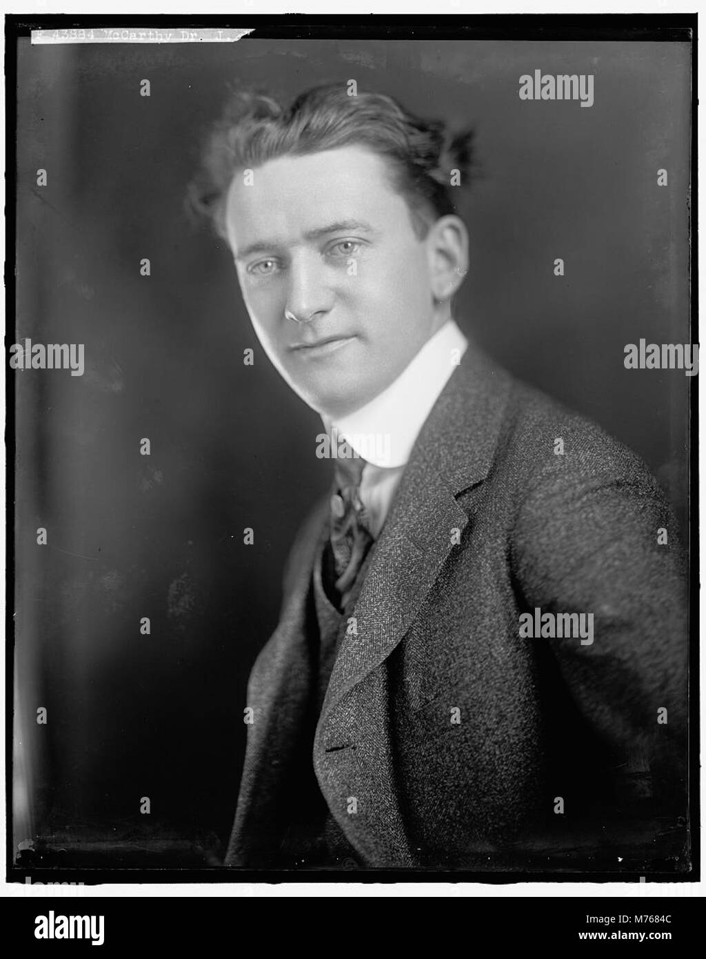 A portrait of Dr. J. McCarthy, capturing his professional identity and ...