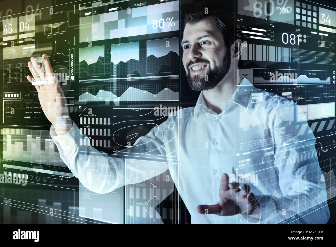 Enthusiastic programmer feeling glad while touching the screen of his computer Stock Photo - Alamy