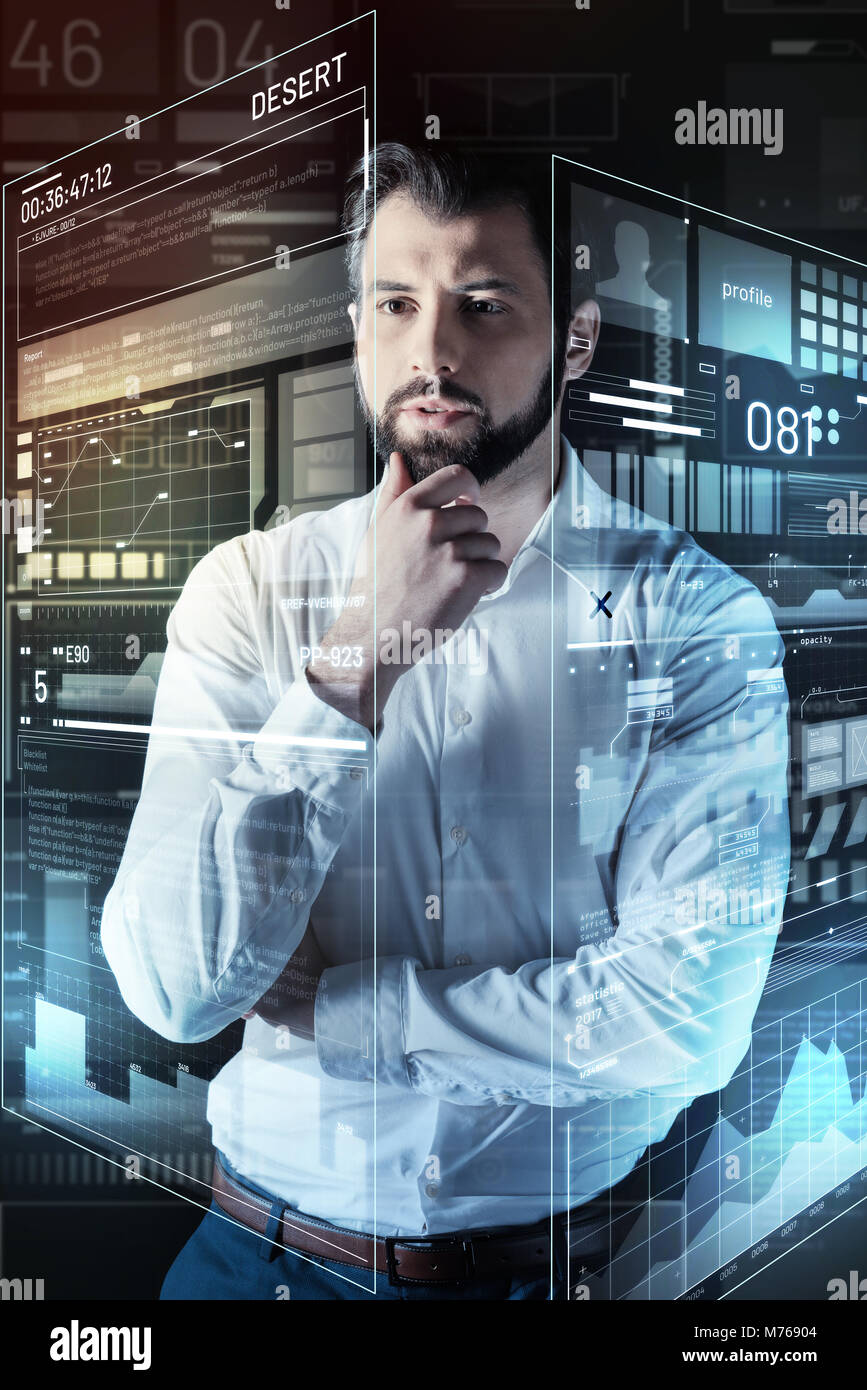 Calm clever programmer touching his beard while thinking Stock Photo ... Calm clever programmer touching his beard while thinking Stock Photo ...