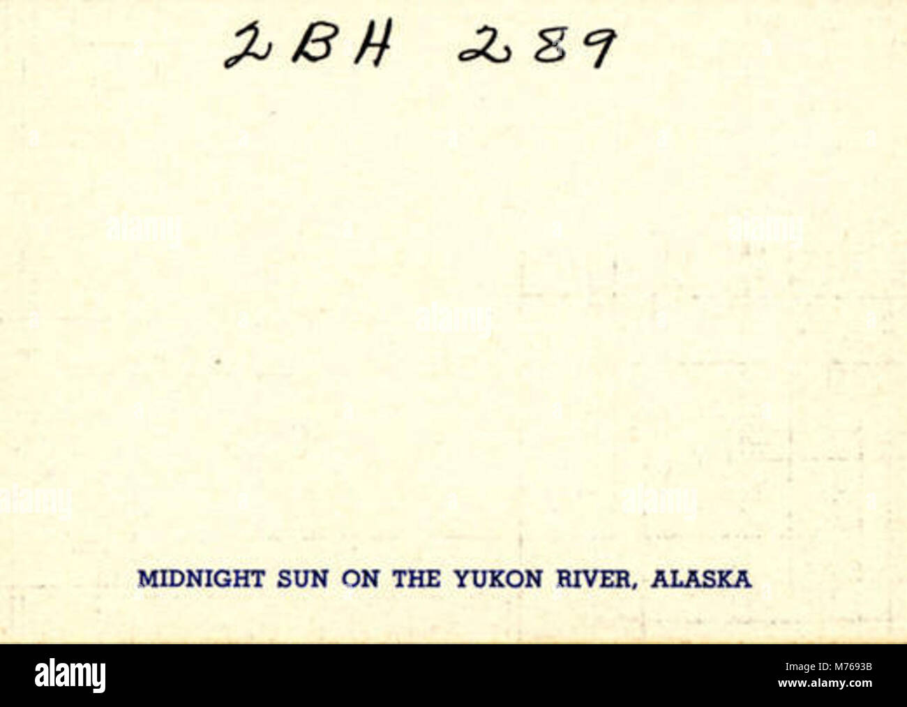 A photograph capturing the midnight sun over the Yukon River ...