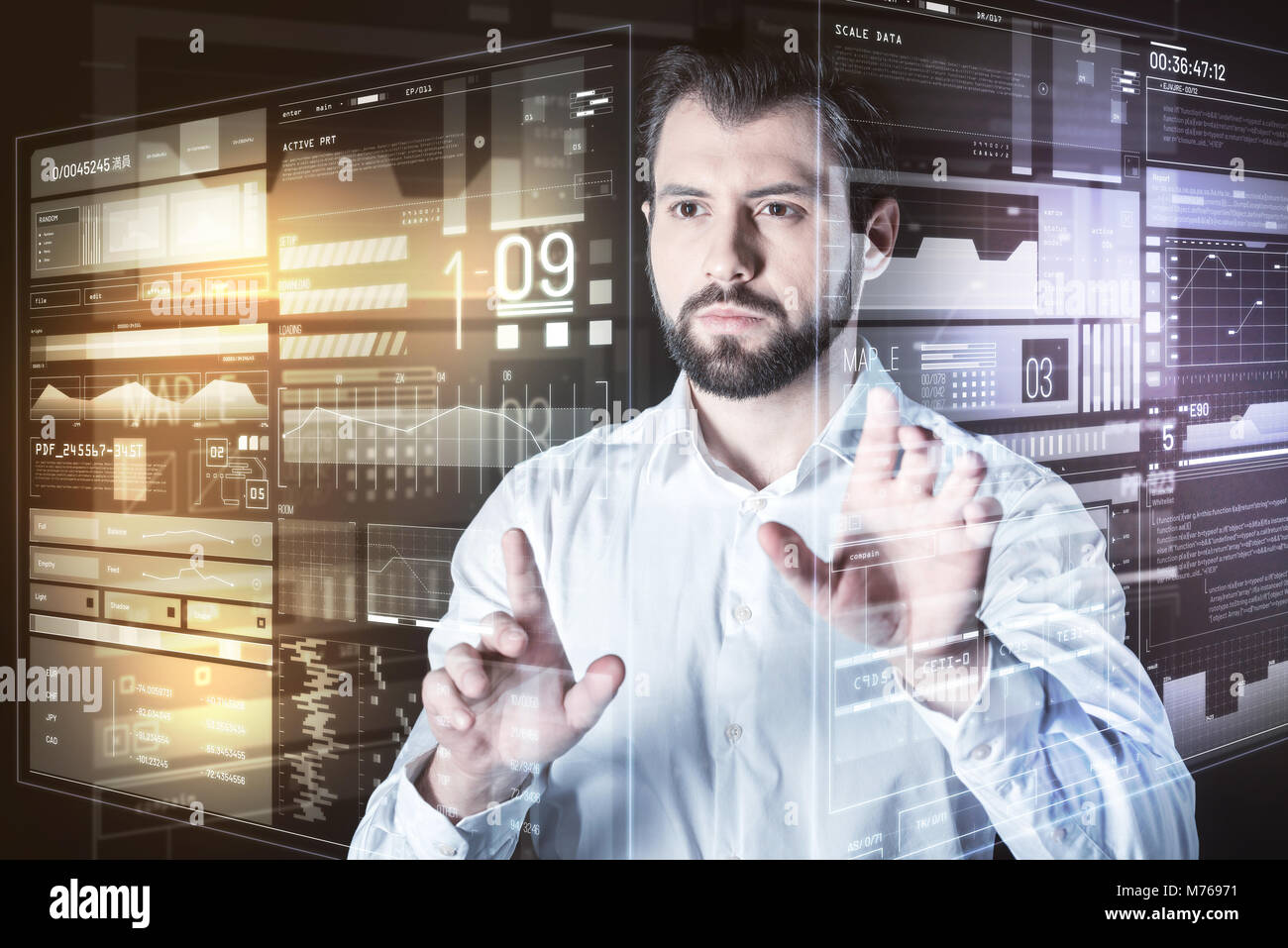 Concentrated programmer frowning while carefully working Stock Photo ...