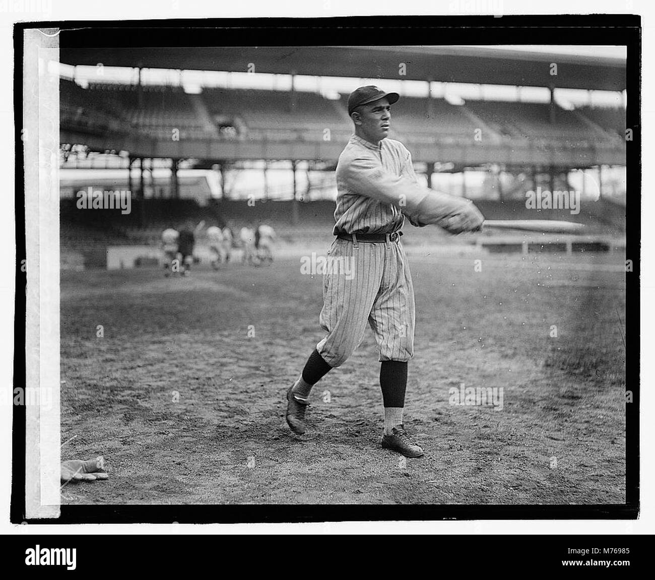 The image is a portrait of Miller from 1921, reflecting the ...