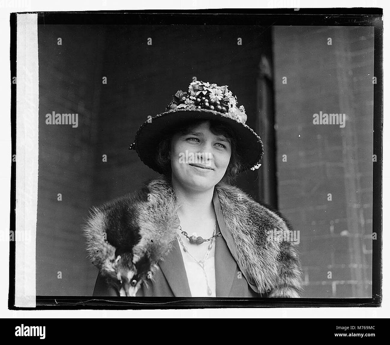 This portrait features Miss Catherine Butterfield, capturing her ...