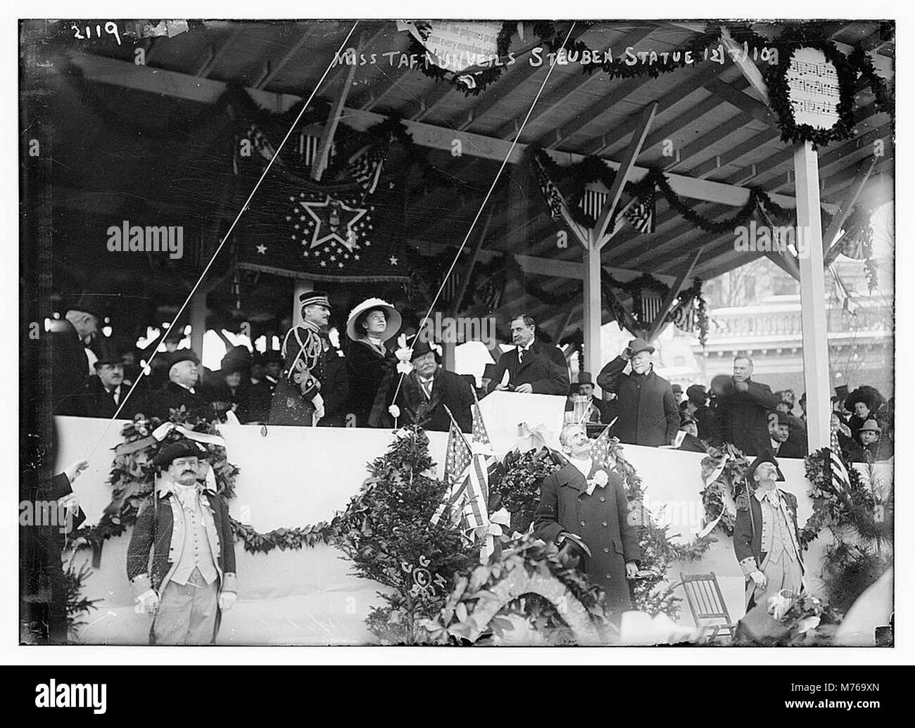 This photograph captures Miss Taft unveiling the Steuben statue, a ...