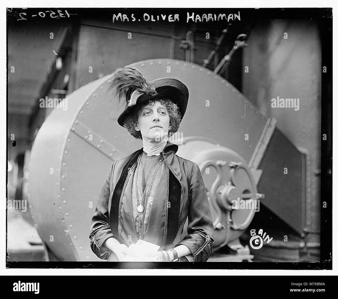 A formal portrait of Mrs. Oliver Harriaman, reflecting her social ...